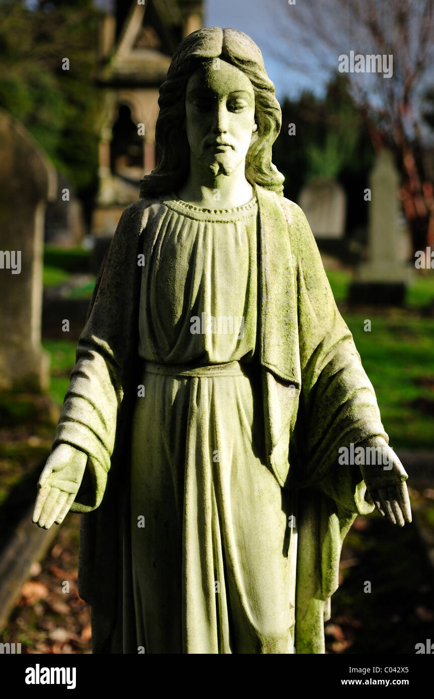 Stone Statue of Jesus Christ In A Cemetery Stock Photo - Alamy