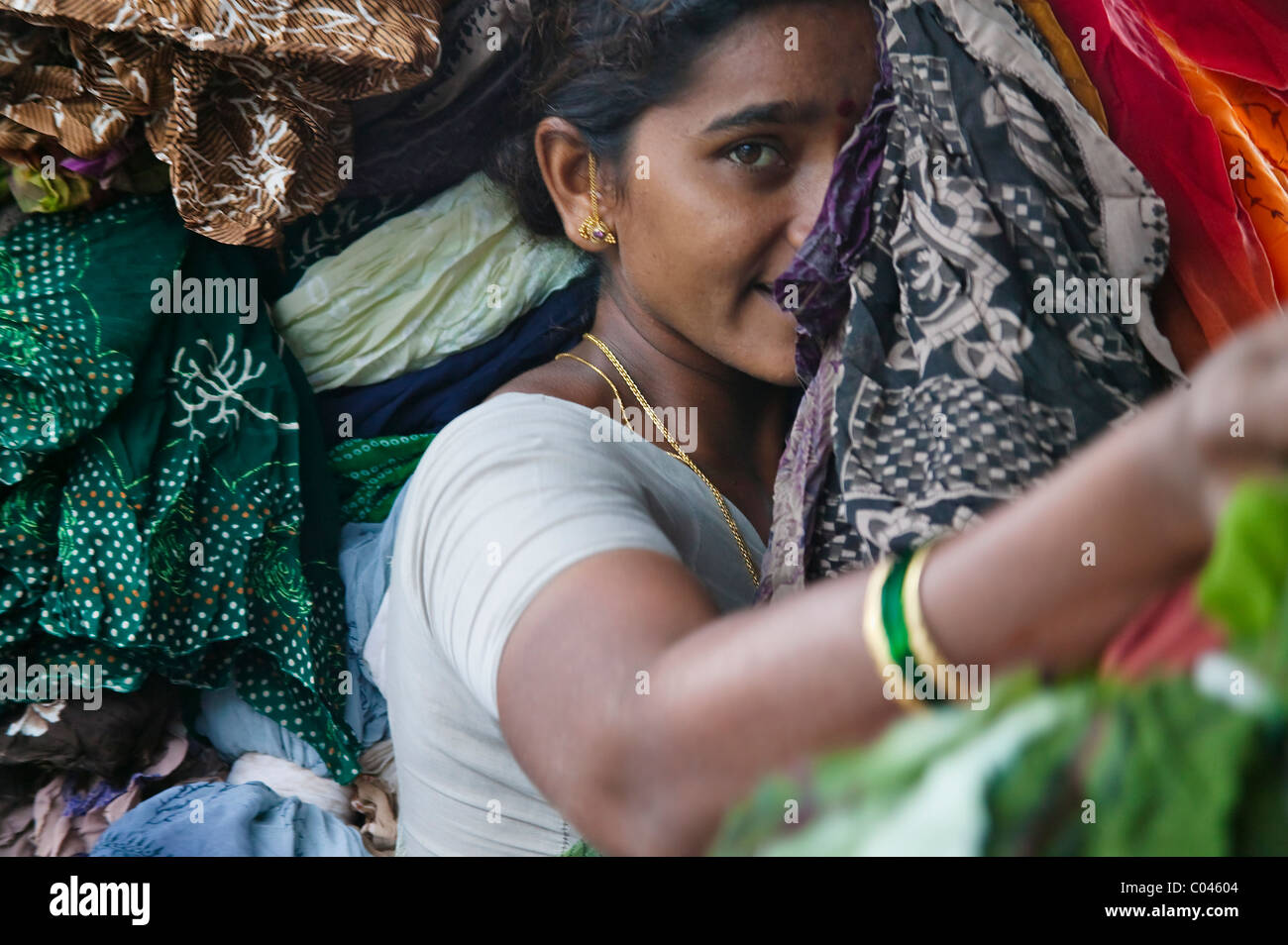 Indian girl washing clothes hi-res stock photography and images - Alamy