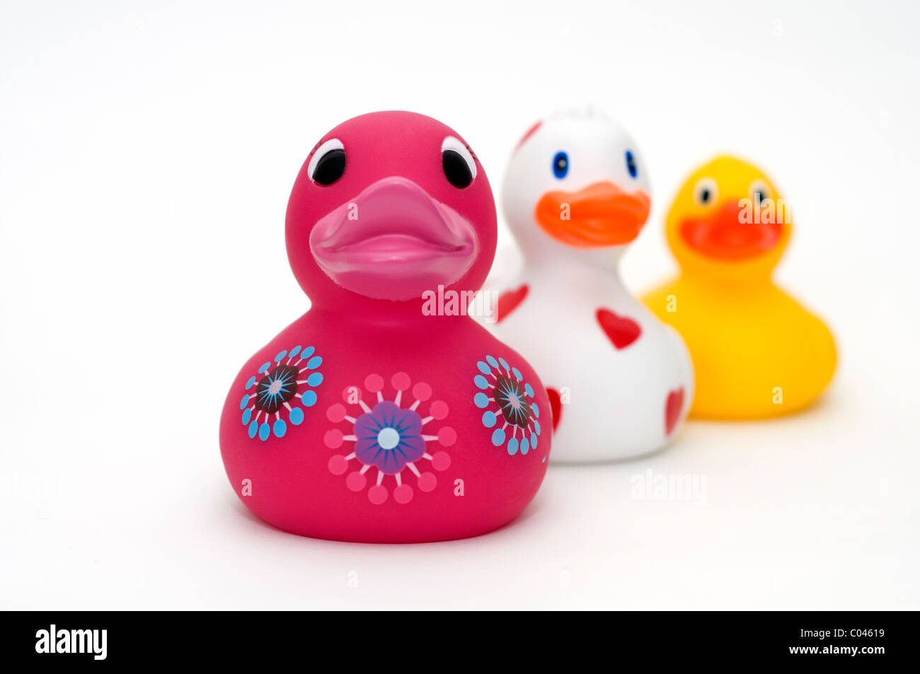 Three colourful rubber ducks on a white background Stock Photo - Alamy