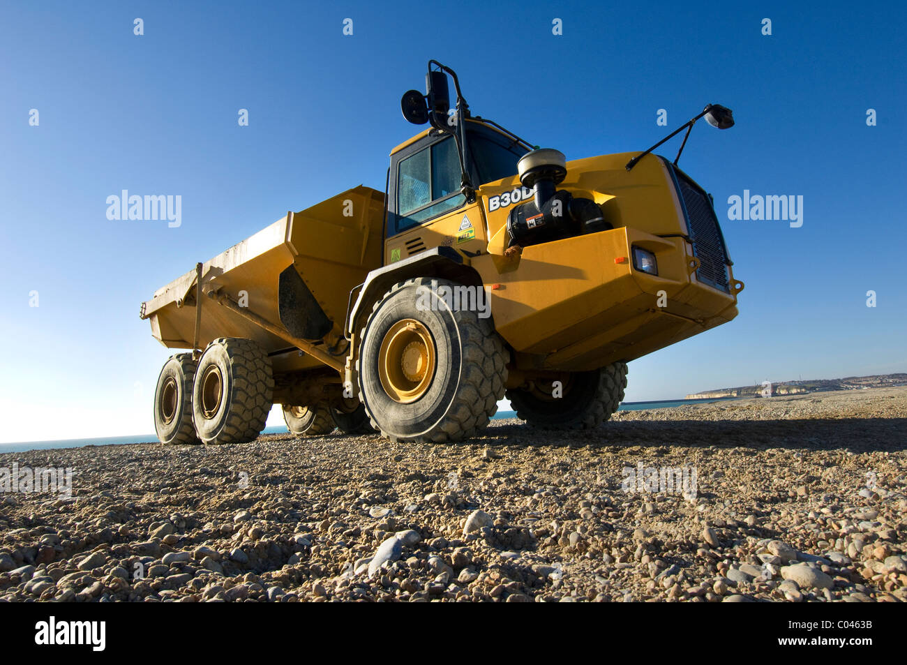 A bell b30d caterpillar dumper truck on seaford beach hi-res stock ...