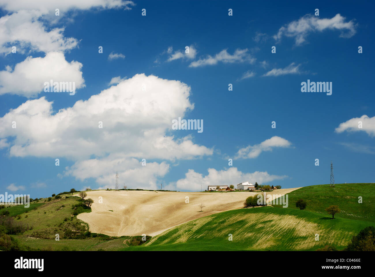 Rural landscape with farm and fields on top hillside Stock Photo - Alamy