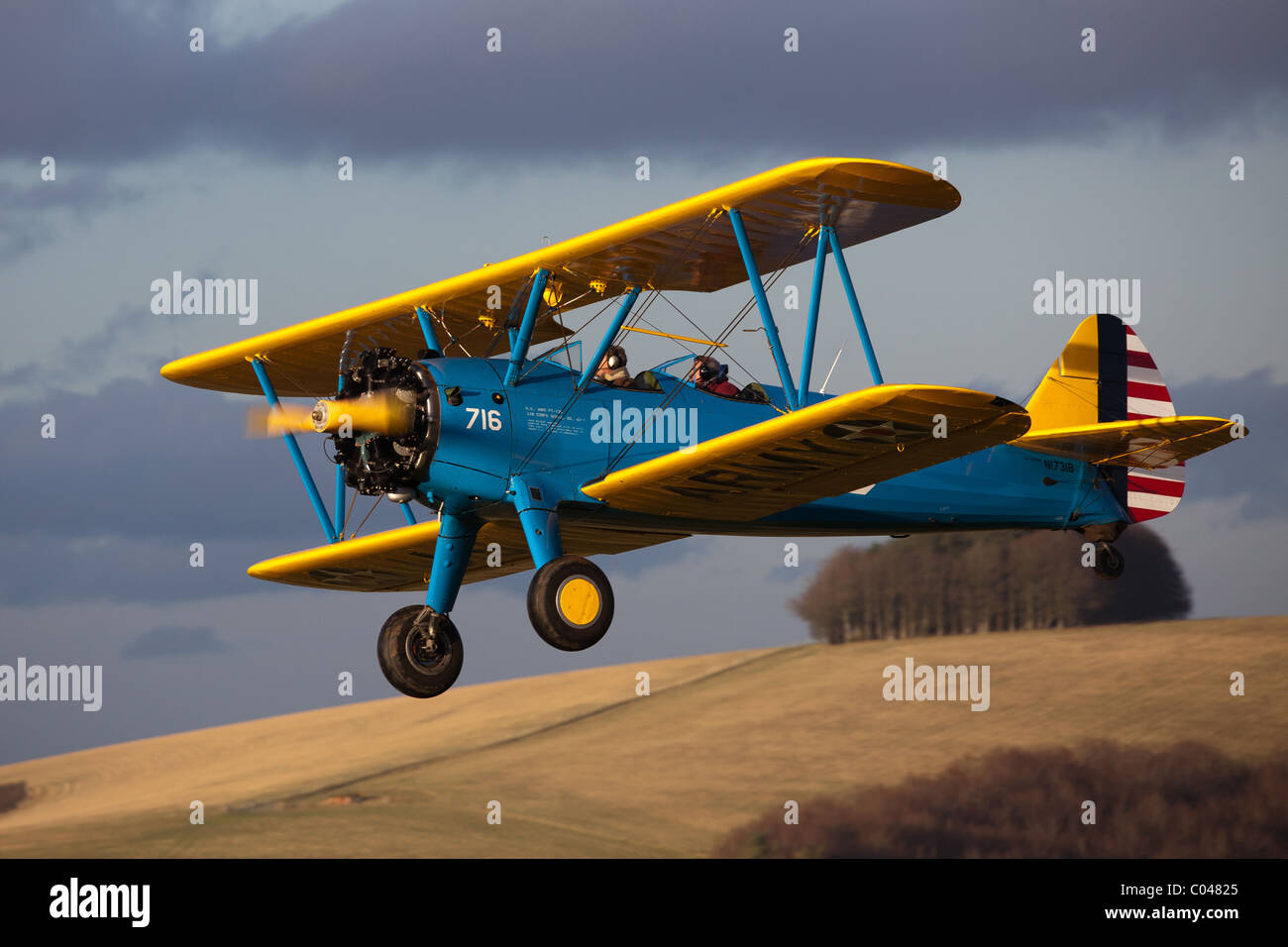A vintage PT13-D Stearman biplane flying at Compton Abbas airfield in ...