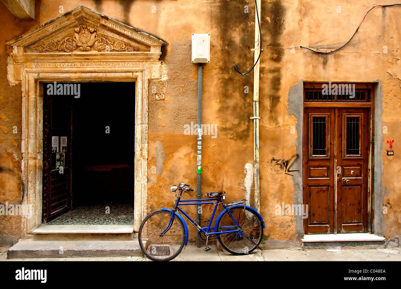 An old door of a Venetian mansion with inscription in latin, in the old ...