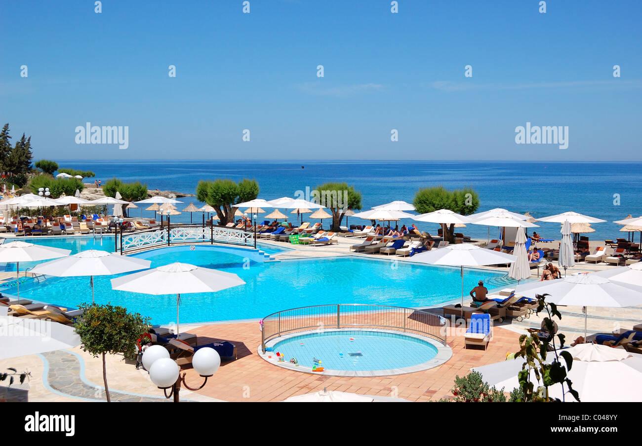 Swimming pool and beach of the luxury hotel, Crete, Greece Stock Photo ...