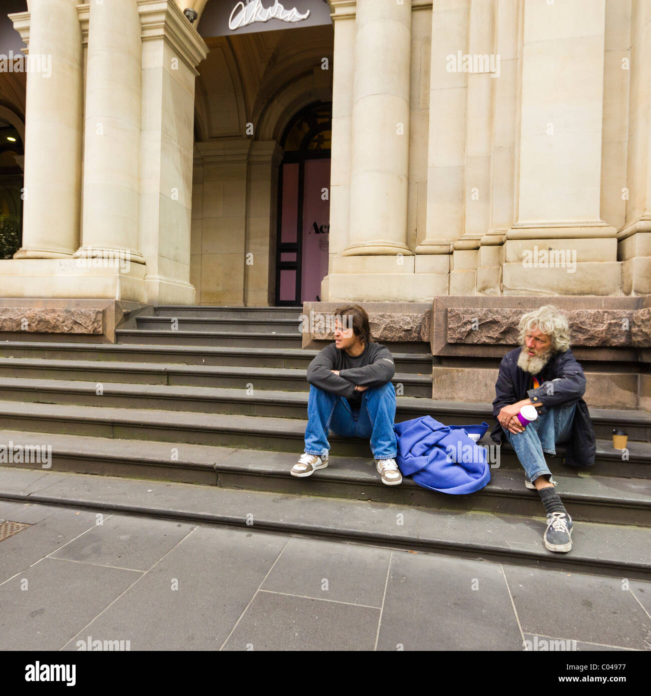 Homeless men begging for loose change Stock Photo - Alamy