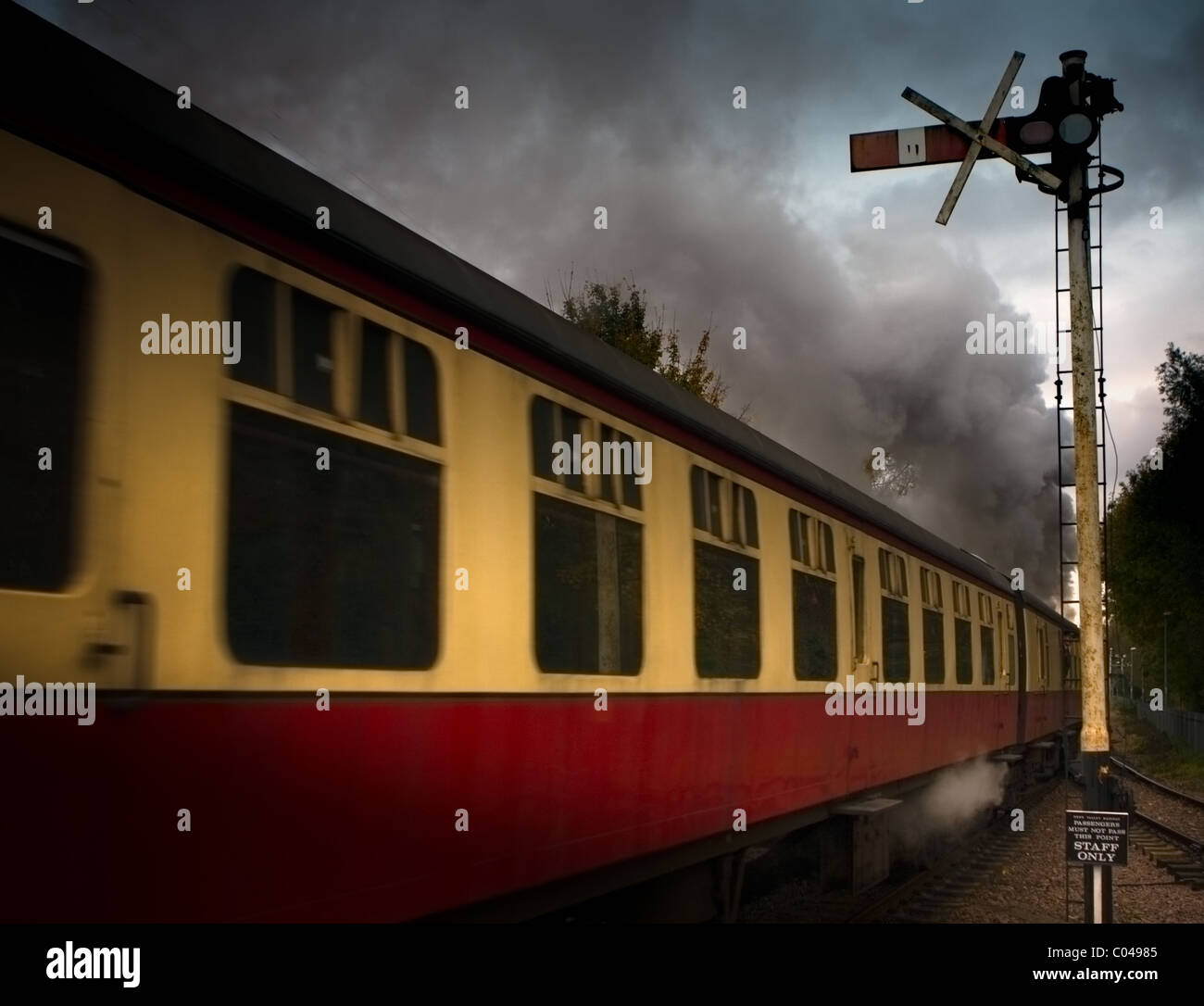 Steam train leaving station - carriages, steam and signal Stock Photo ...