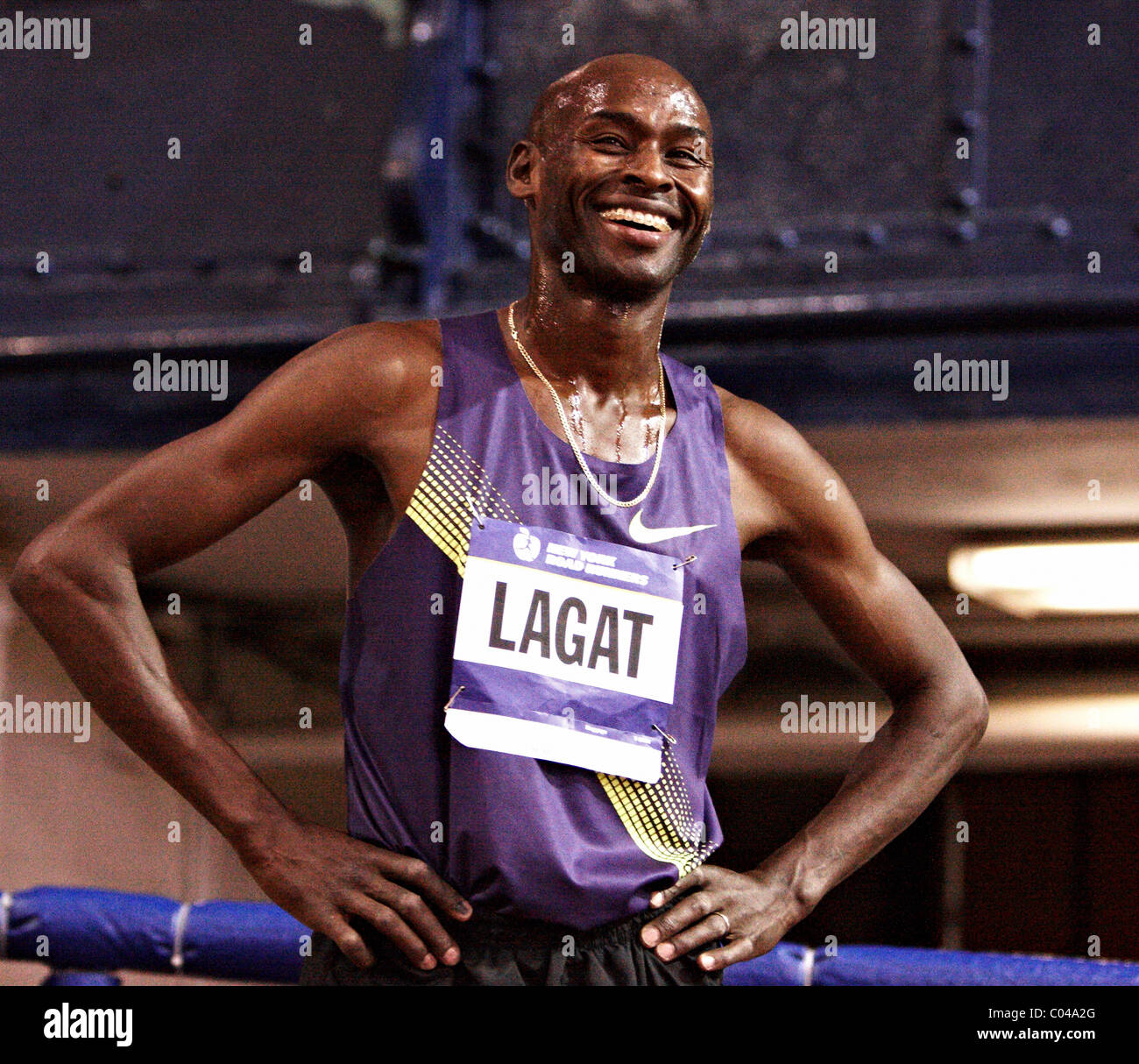 Bernard Lagat standing triumphant after setting the American record for ...