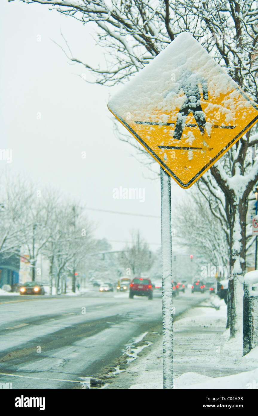 Crosswalk/crossing sign partially covered with snow Stock Photo - Alamy