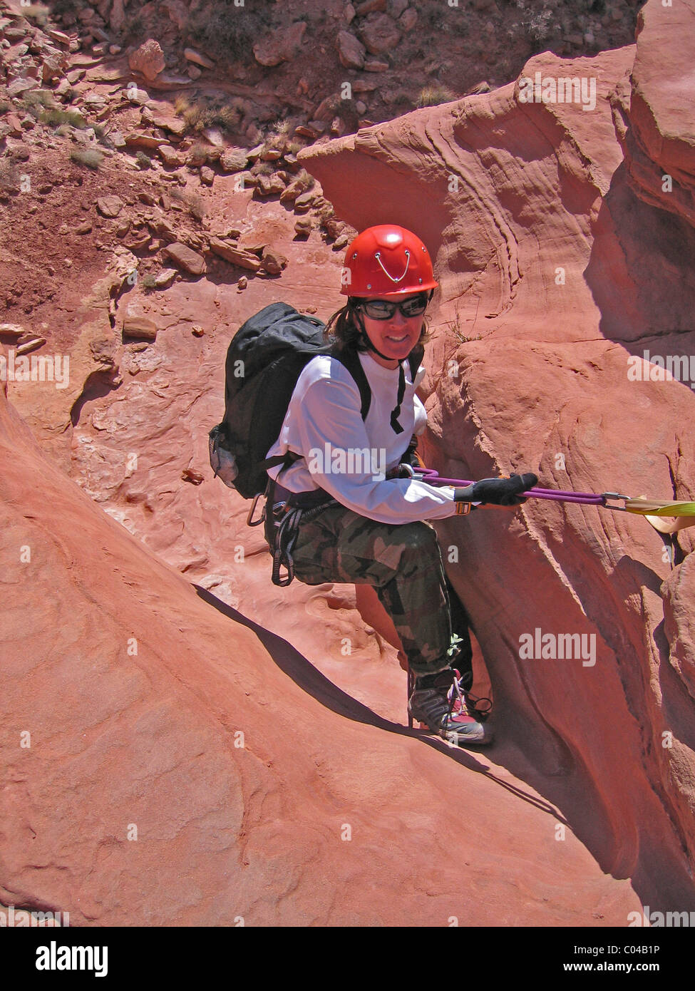 Rappelling into a slot canyon deep in the Utah backcountry Stock Photo ...