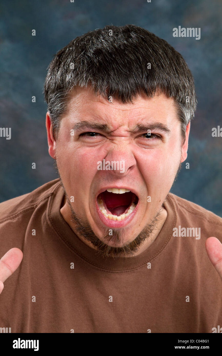 Suffering man show the emotion on his face Stock Photo - Alamy