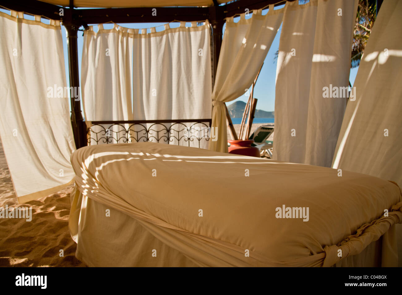 Massage bed in a tent on tropical beach hi-res stock photography and ...