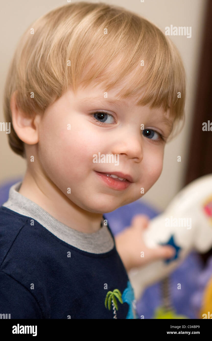 A mischievous toddler gives a questioning look Stock Photo - Alamy
