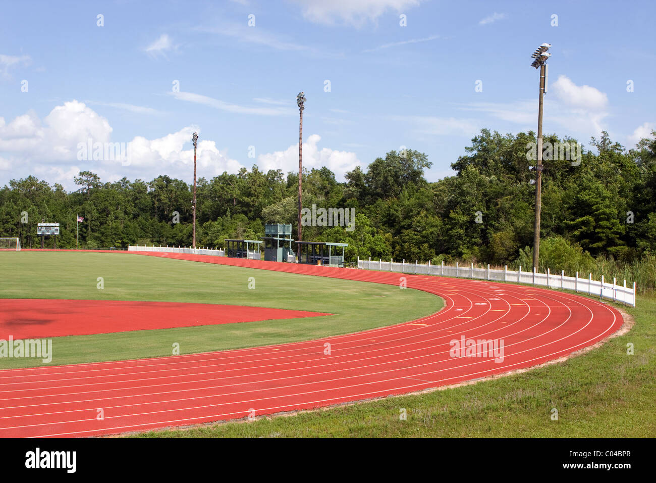 An empty track and soccer field sits unused ready for athletes Stock ...