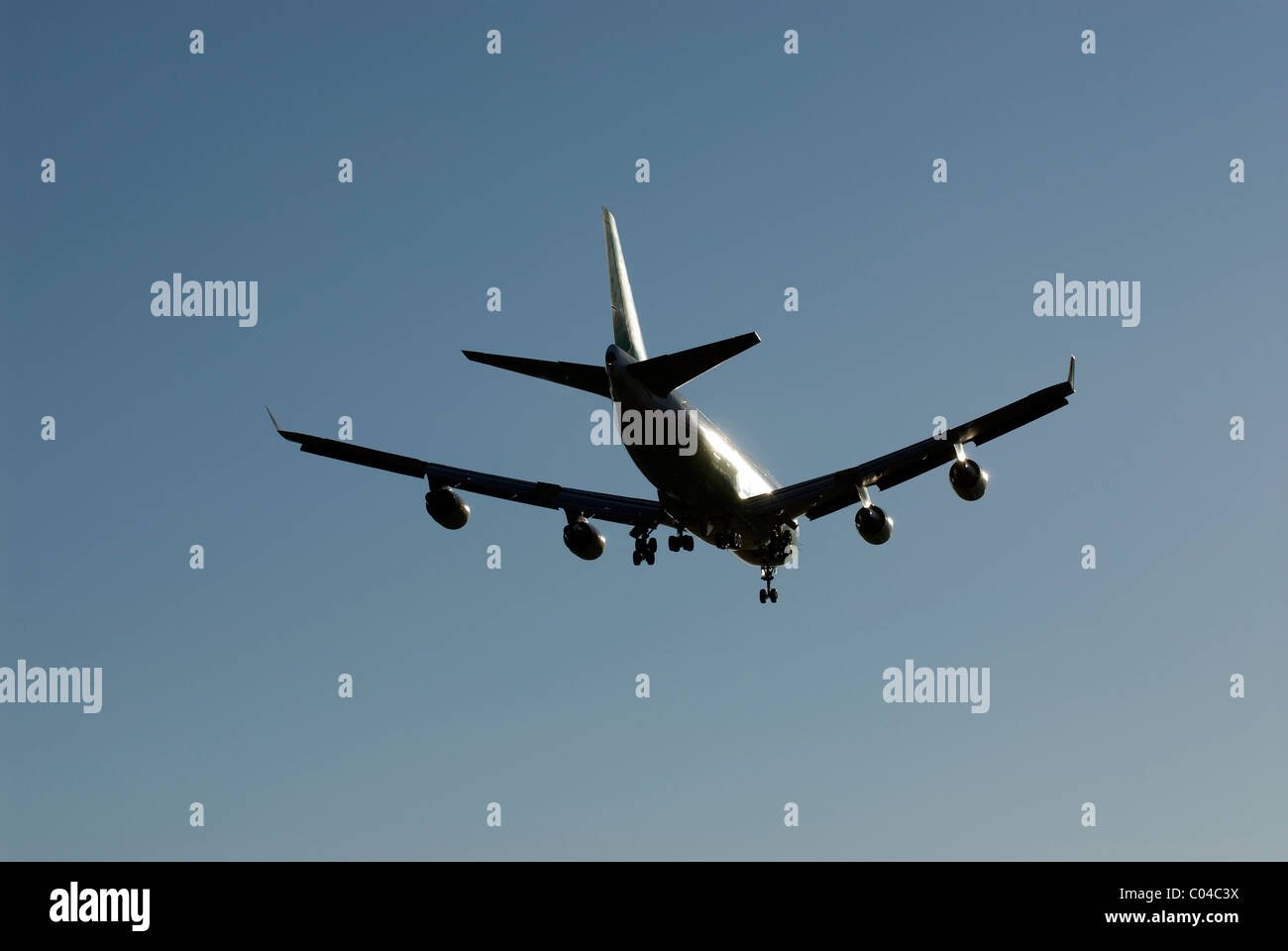 Airplane before landing, isolated on blue Stock Photo - Alamy