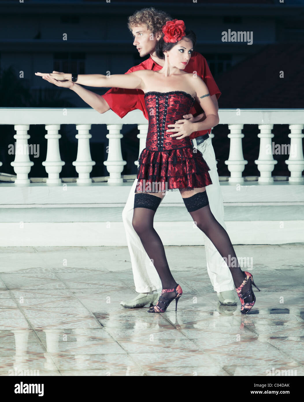 Couple dancing tango at the night time Stock Photo - Alamy