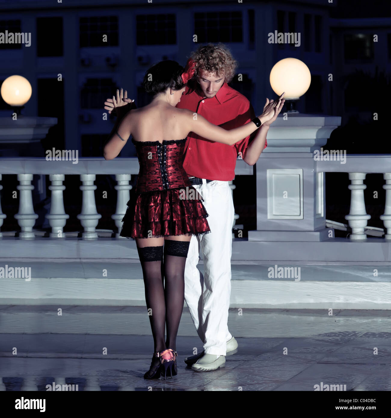 Couple dancing tango at the night time Stock Photo - Alamy