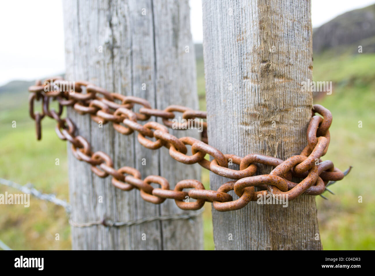 Rusty chain used to close a gate at a farm in Iceland Stock Photo - Alamy