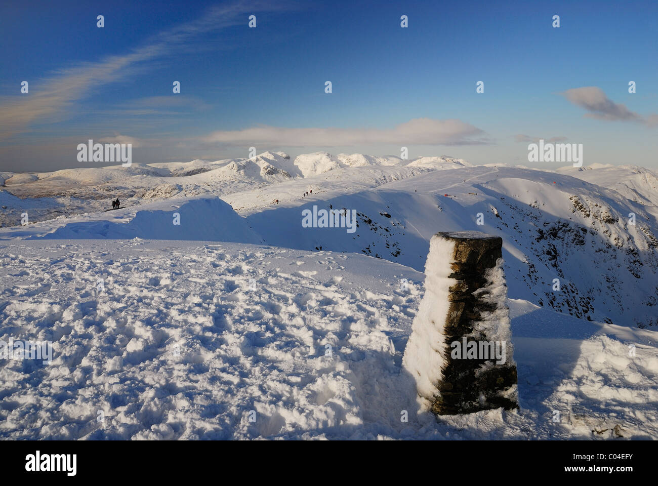 Coniston Old Man summit cairn in winter in the English Lake District ...