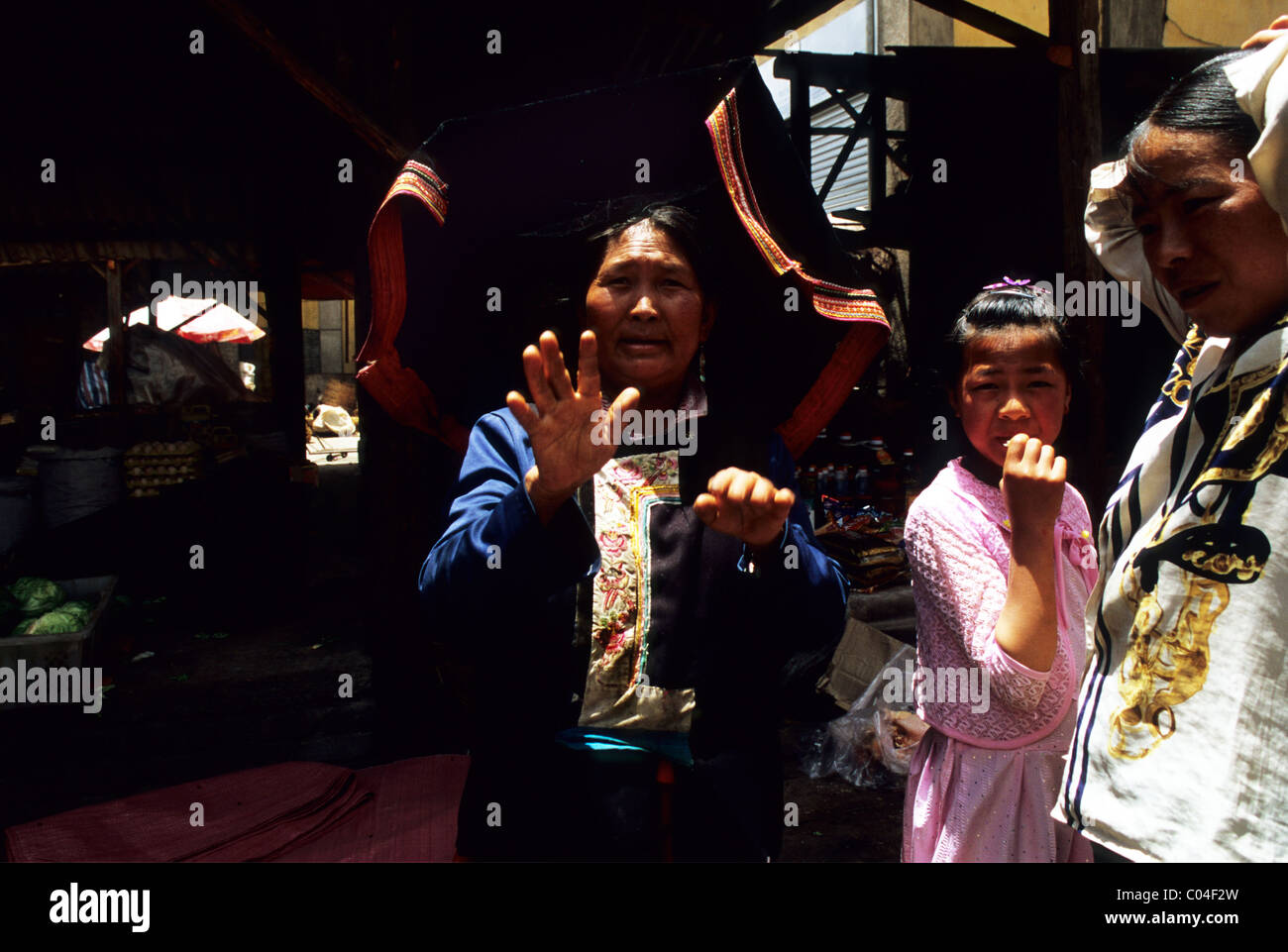 A colorful Yi woman Stock Photo - Alamy