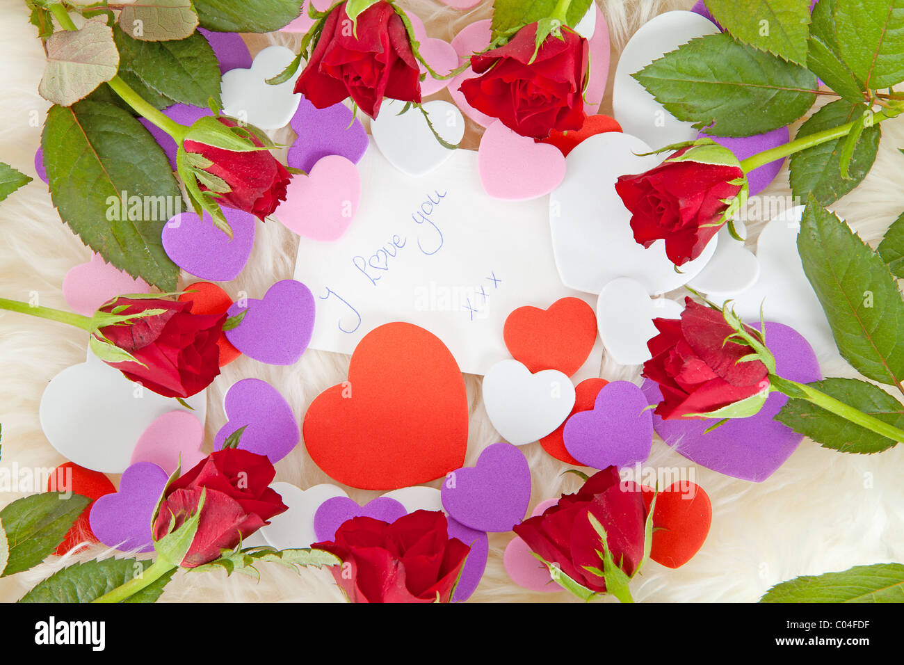 Romantic note: I love you with roses and hearts Stock Photo - Alamy