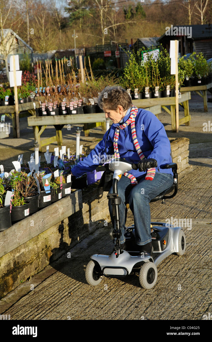 Mobility scooter user riding an ultra light battery powered machine in ...