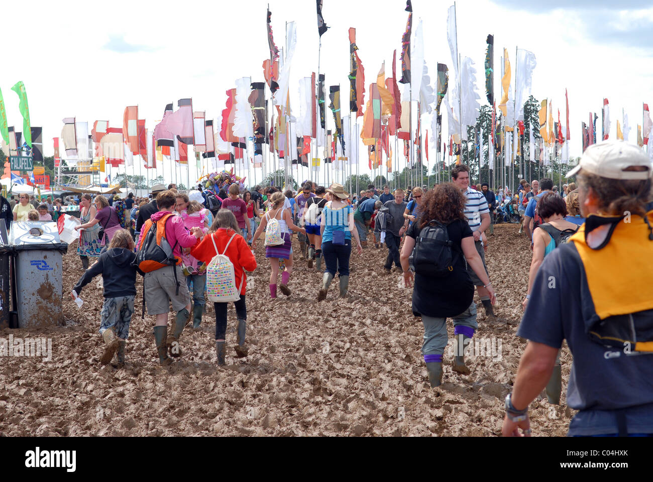 People struggling through thick mud at WOMAD Festival, Malmesbury ...
