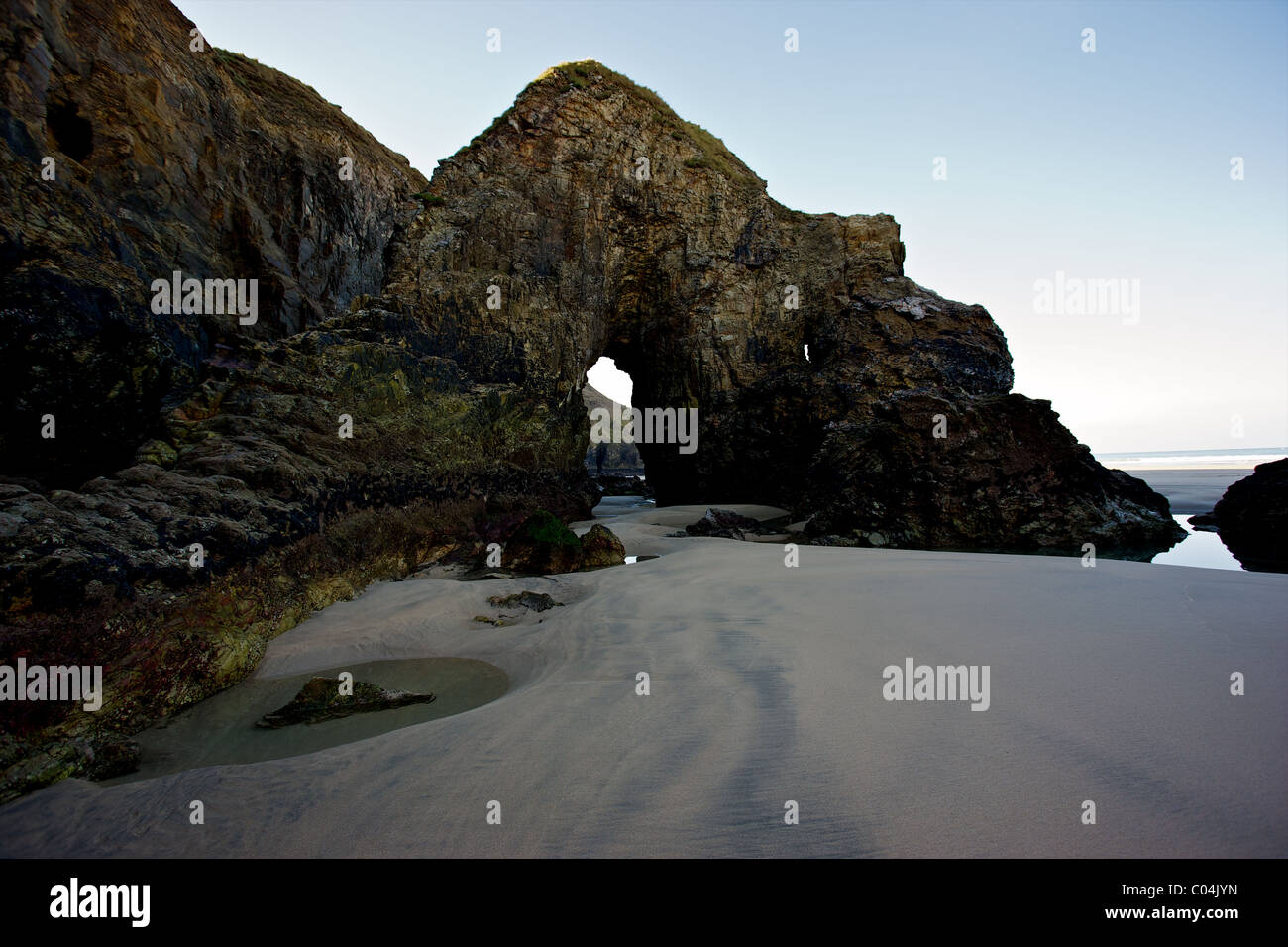 Rock arch perranporth beach cornwall hi-res stock photography and ...