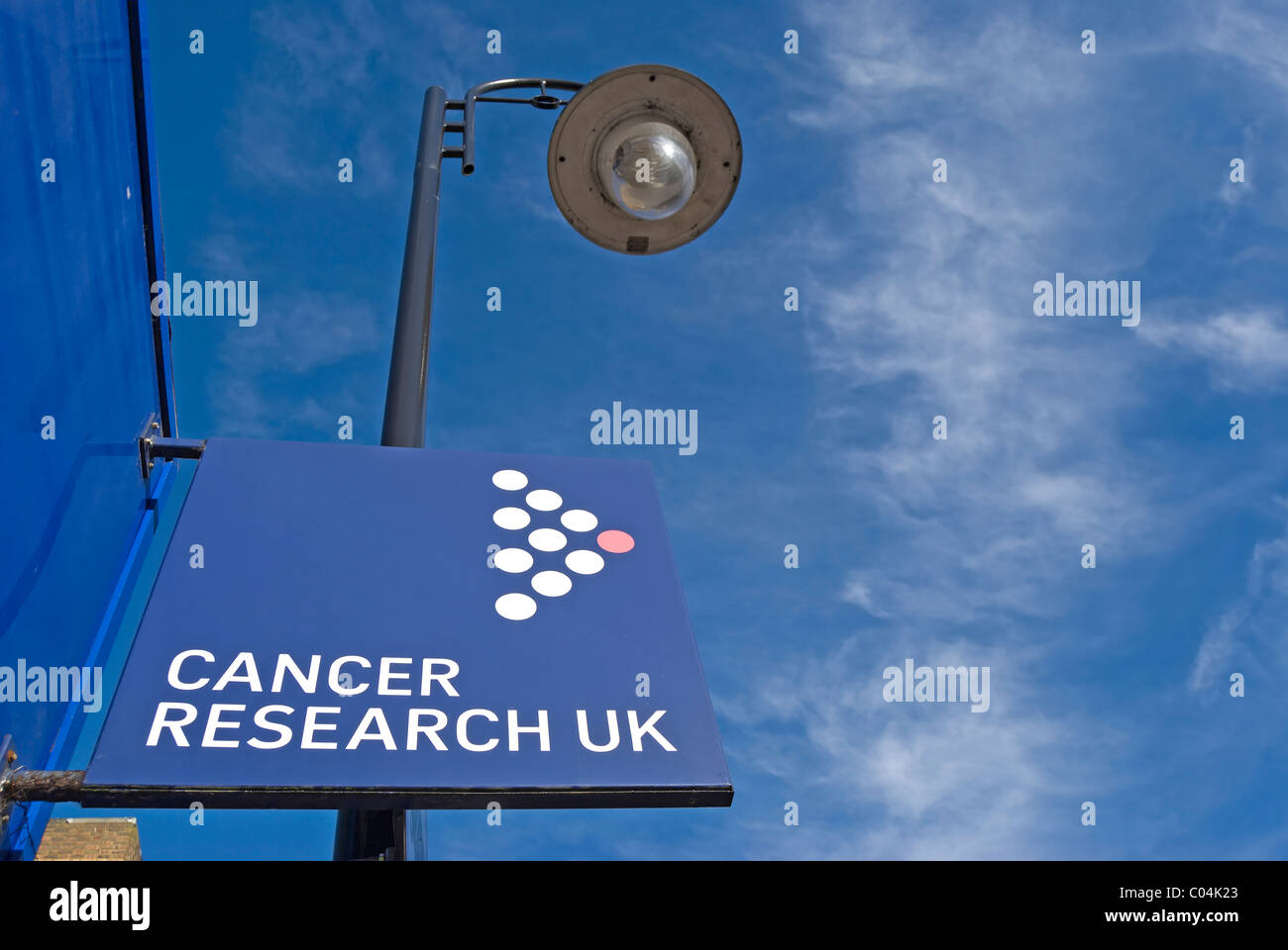 sign for cancer research uk at a branch of the national charity shop ...