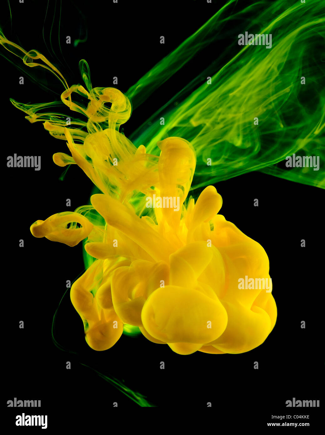 Yellow ink in the water Stock Photo - Alamy
