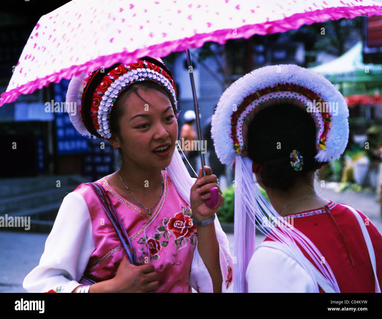 Colorful Bai women in Yunnan Stock Photo - Alamy