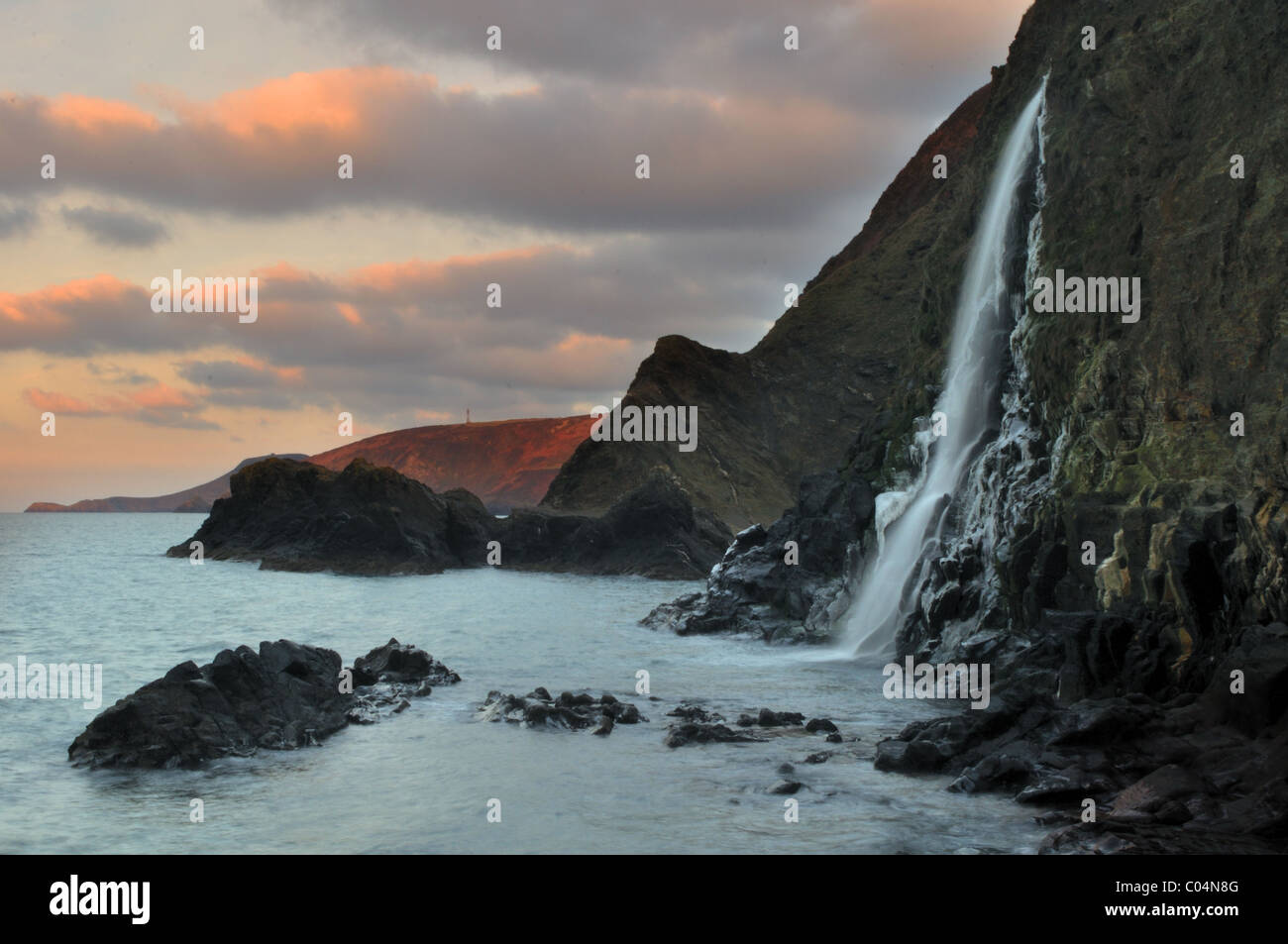 Waterfall at Tresaith beach, Aberporth, frozen in winter Stock Photo ...