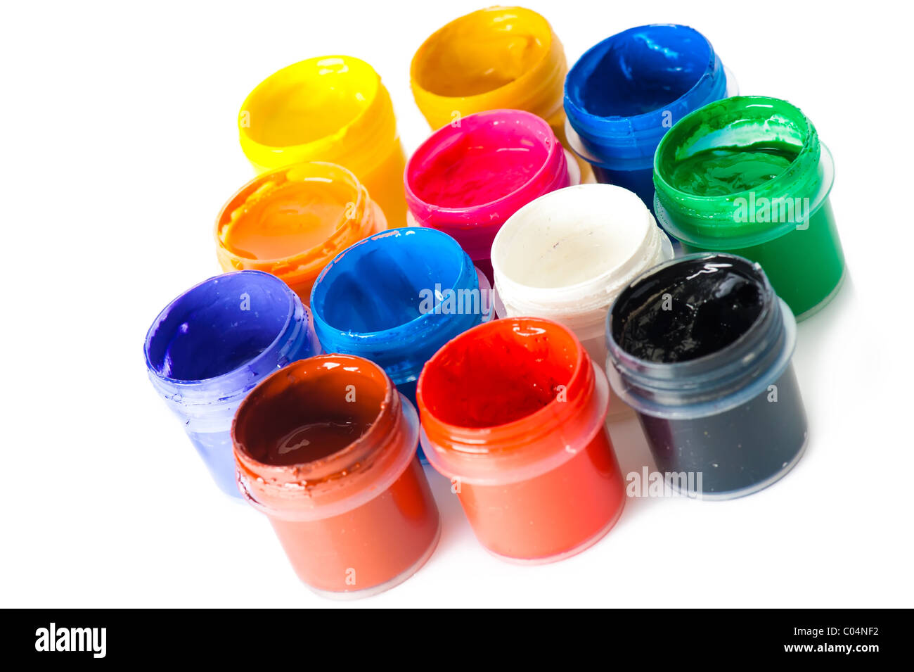 Set of used multicolored watercolor paint in containers on white ...