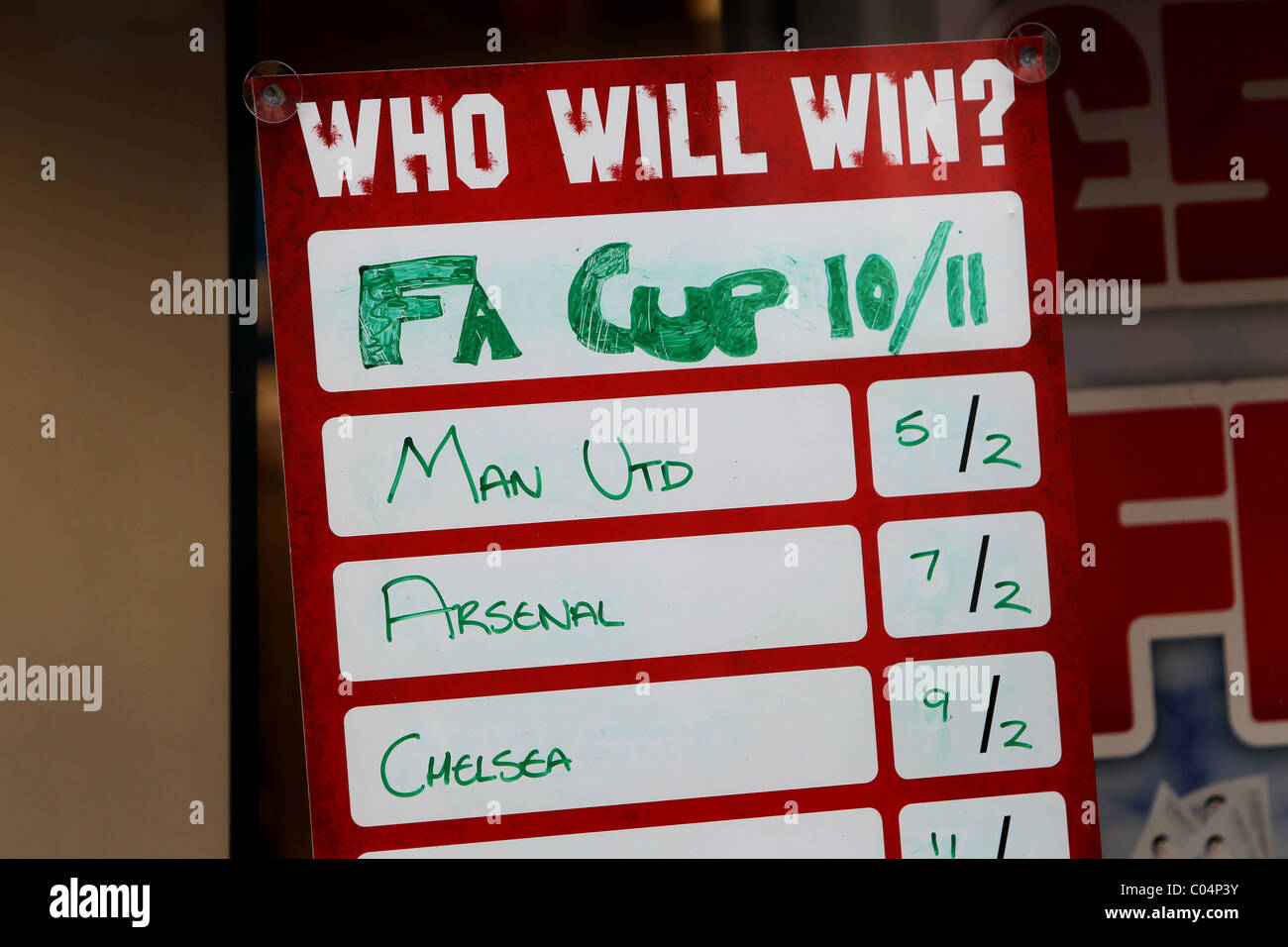 Betting shop window display promoting the odds on football teams to win ...