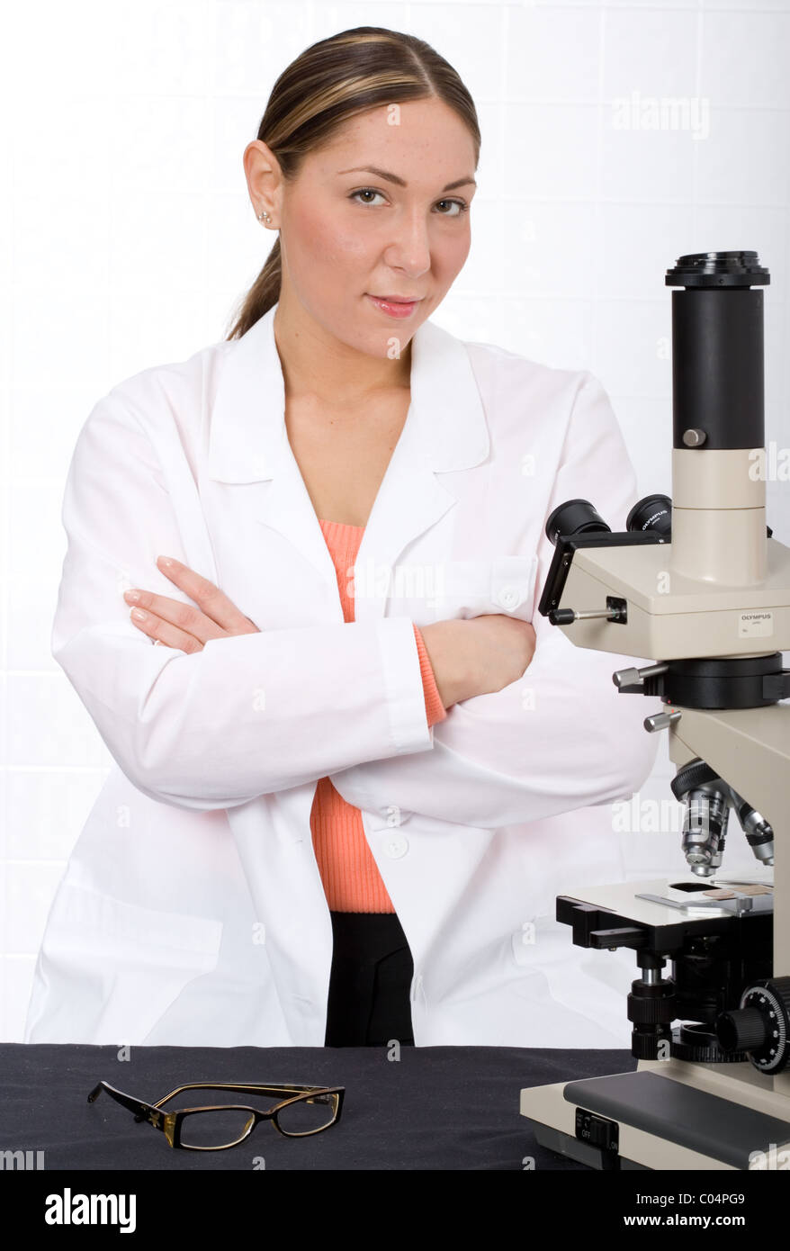 Portrait of young researcher at microscope Stock Photo - Alamy