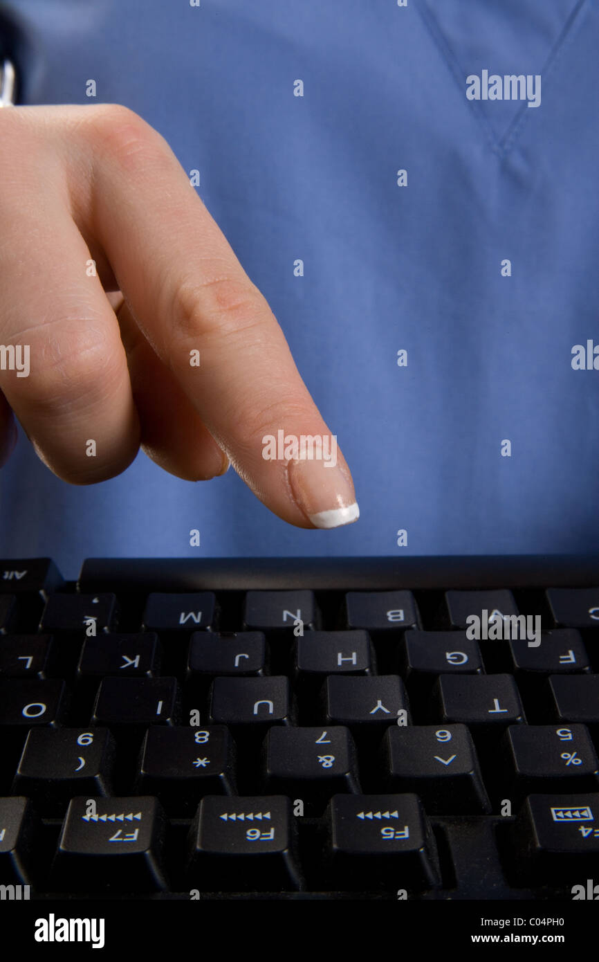 Finger at keyboard Stock Photo - Alamy