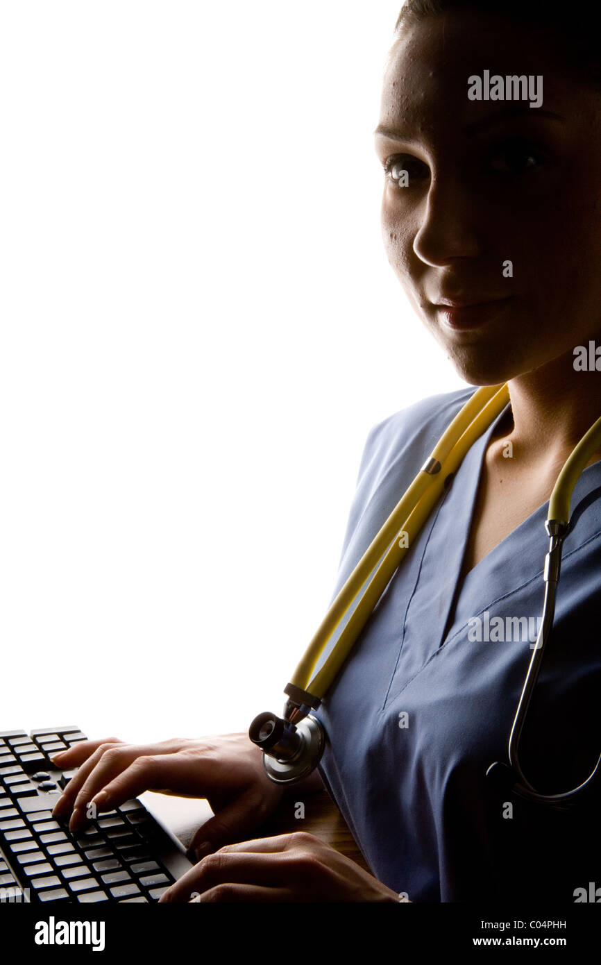 Nurse at keyboard entering or looking up patient information Stock ...