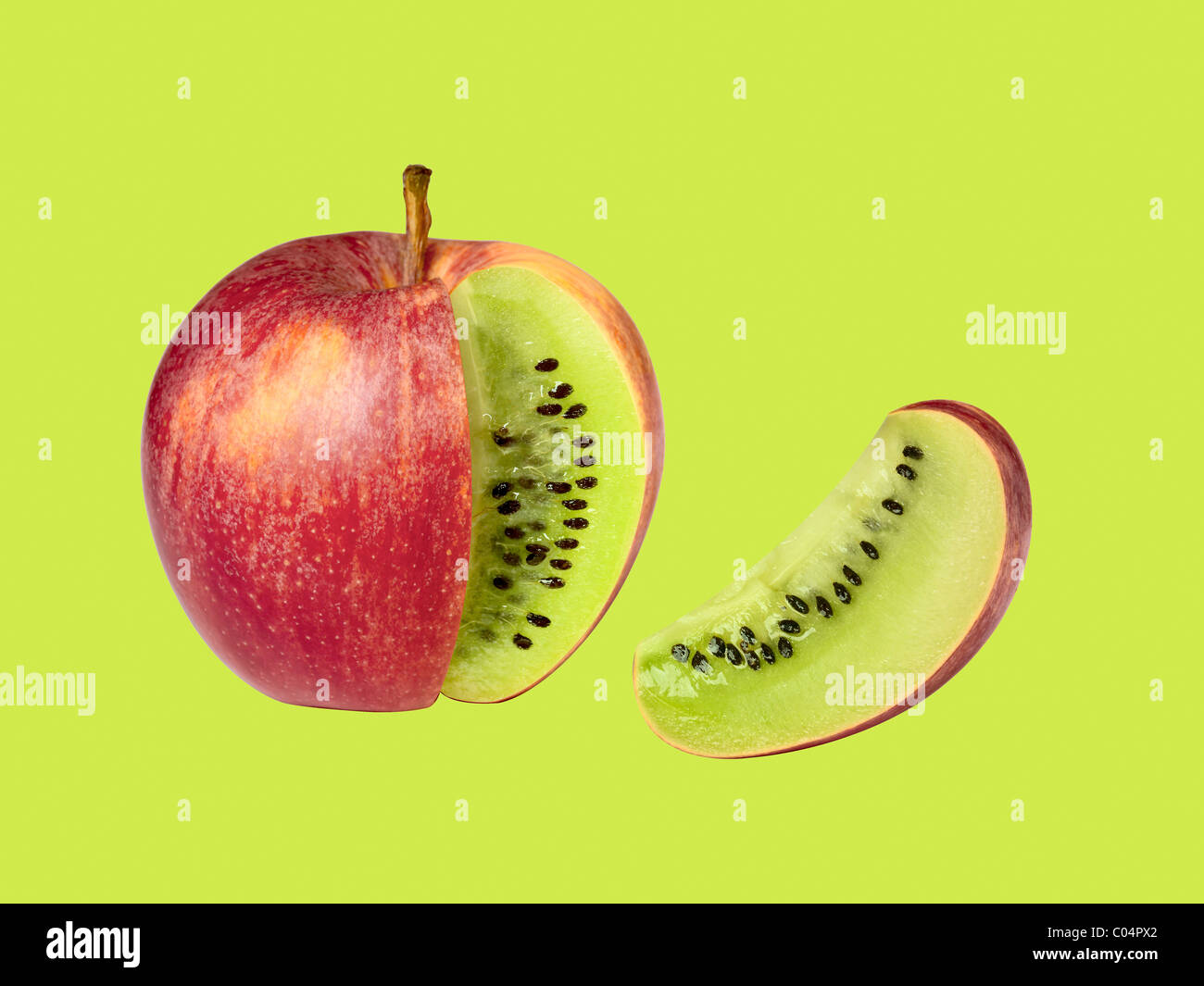 transgenic apple kiwi isolated on green background Stock Photo - Alamy