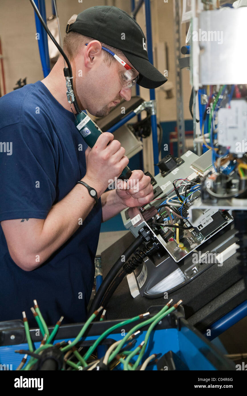 Workers Assemble Charging Stations for Electric Cars Stock Photo - Alamy