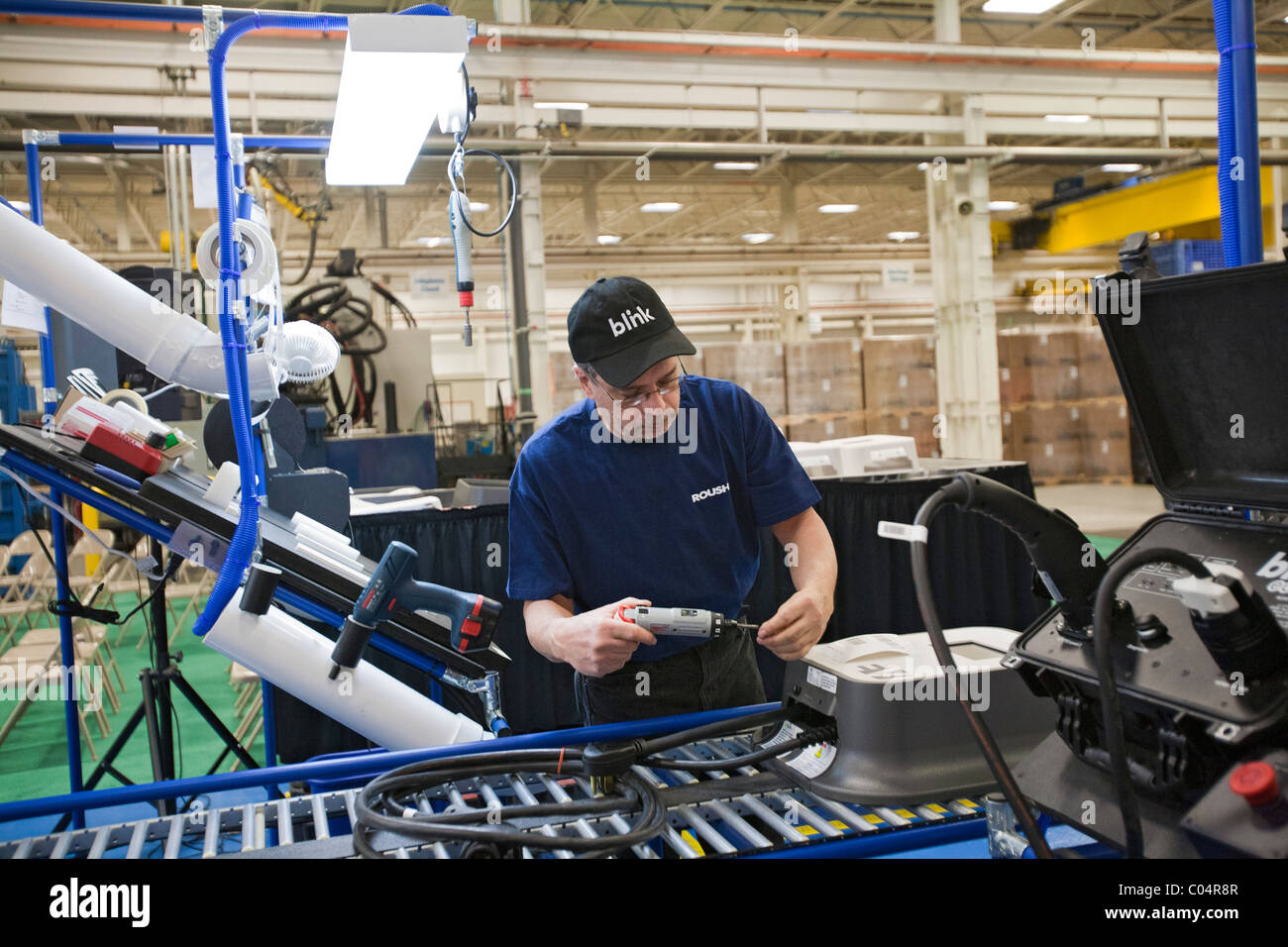 Workers Assemble Charging Stations for Electric Cars Stock Photo - Alamy