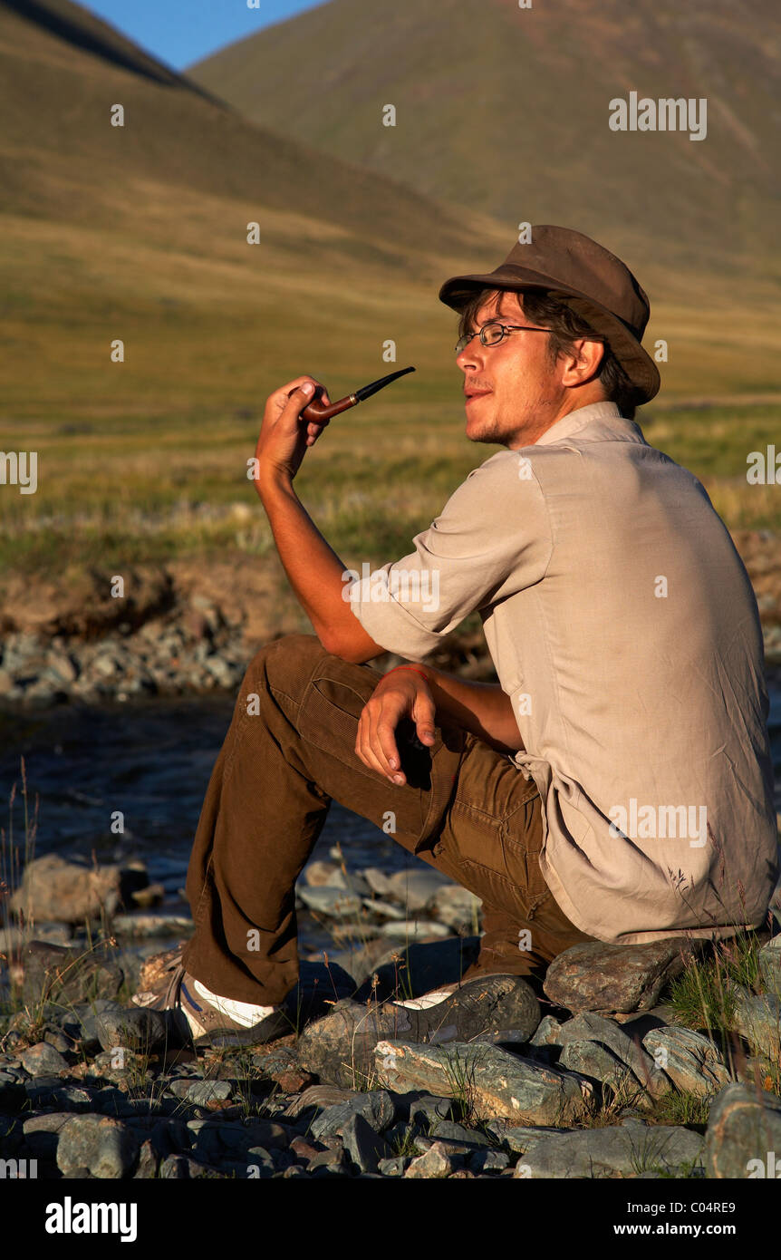 man is smoking tobacco-pipe in the mountains Stock Photo - Alamy