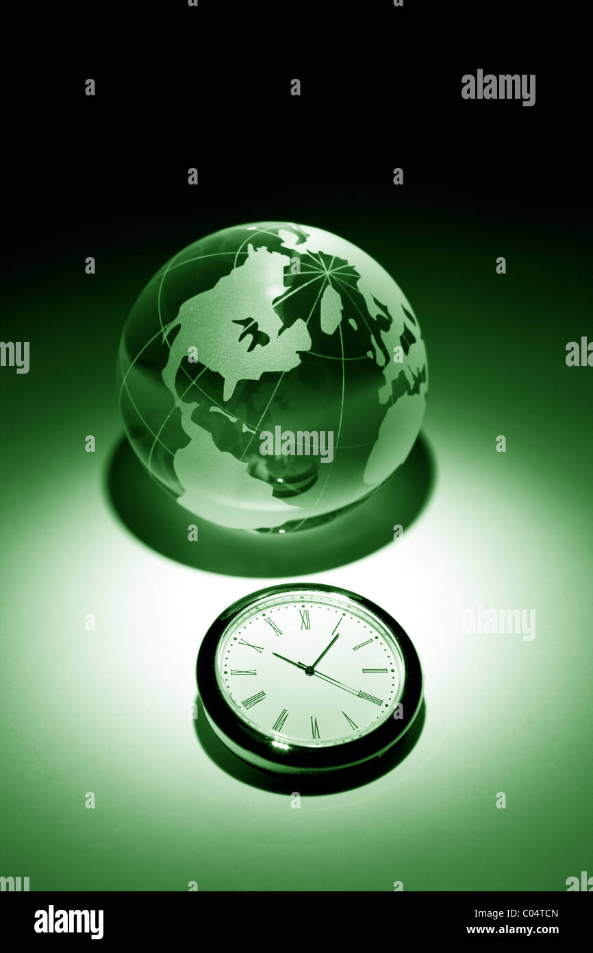 Globe and clock for background Stock Photo - Alamy