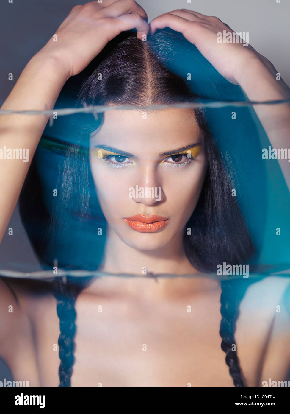 Artistic expressive beauty portrait of a young beautiful woman behind ...