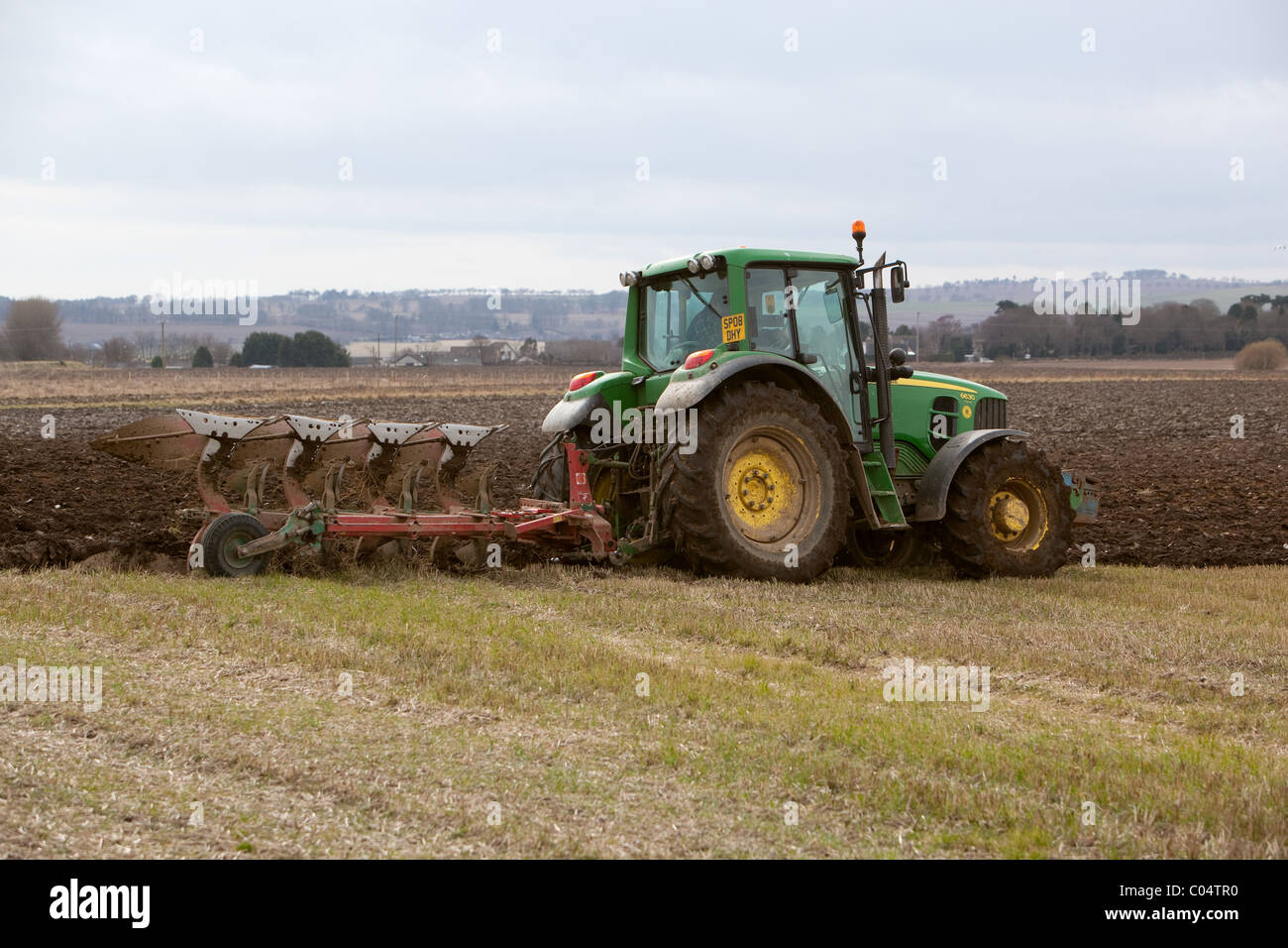 Farmer commencing ploughing new furrows Scotland Stock Photo - Alamy