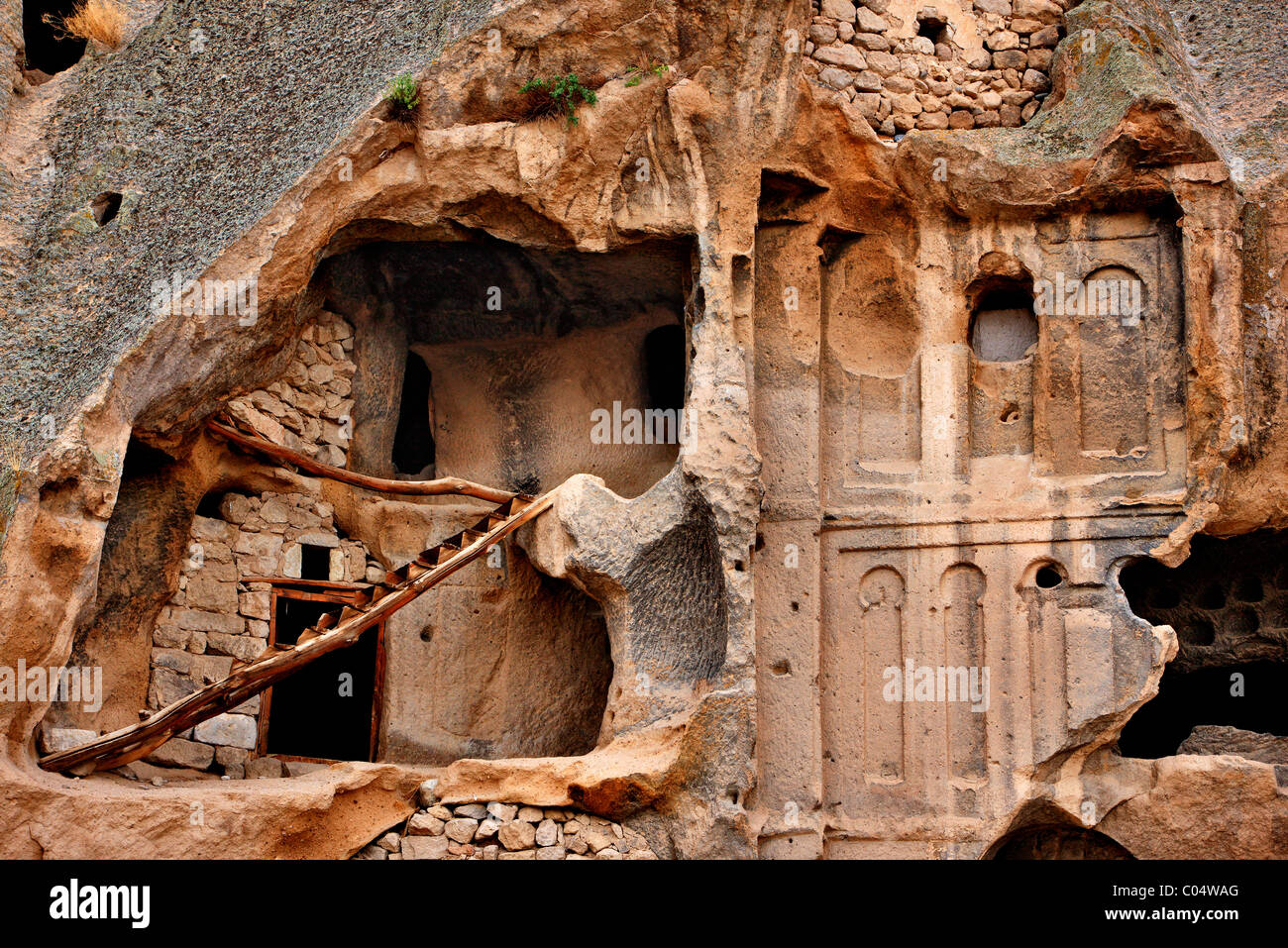 Facade of rock cut church and "cavehouses" in Yaprakhisar, at the exit ...