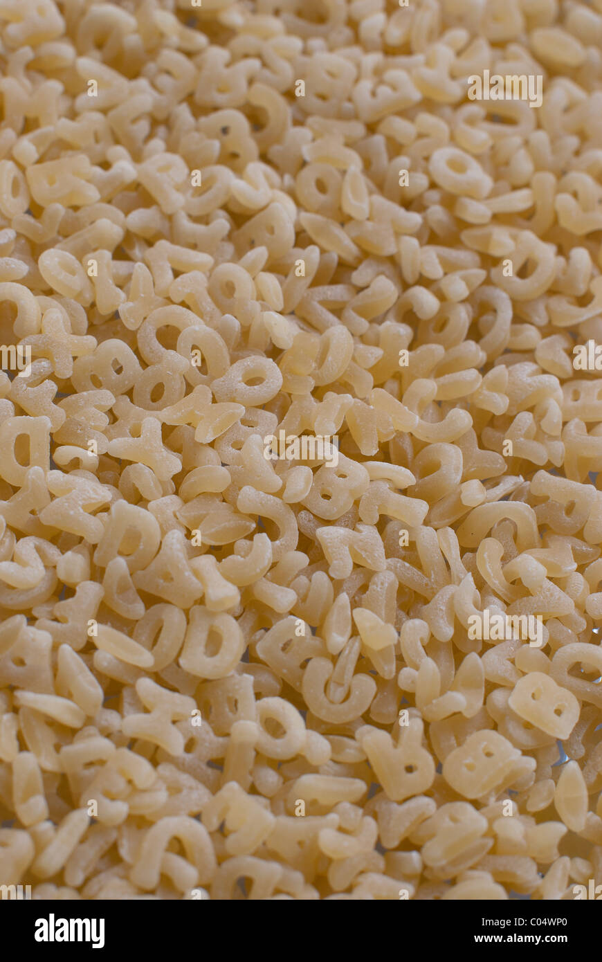 Close-up background of alphabet noodle showing letters Stock Photo - Alamy