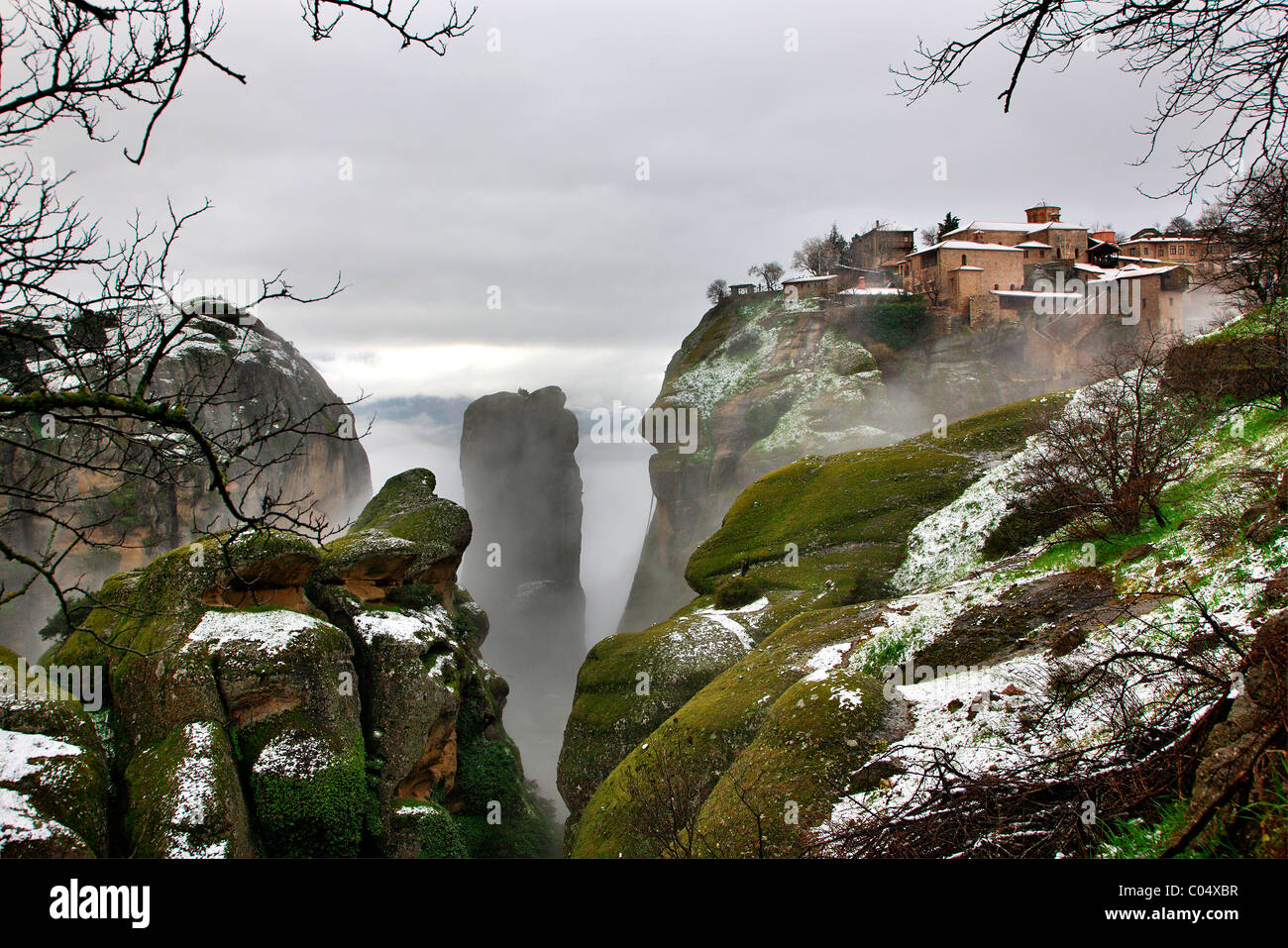 Greece, Meteora. Winter atmosphere with fog and snow. On the upper ...