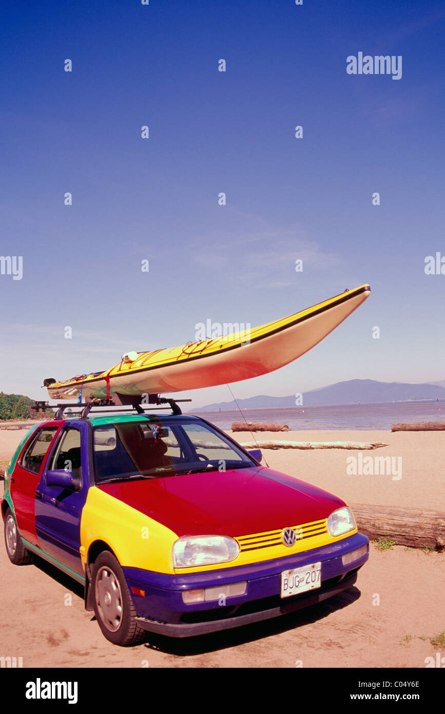 Yellow Kayak mounted on Multicolored Volkswagen Roof, VW Car parked on ...