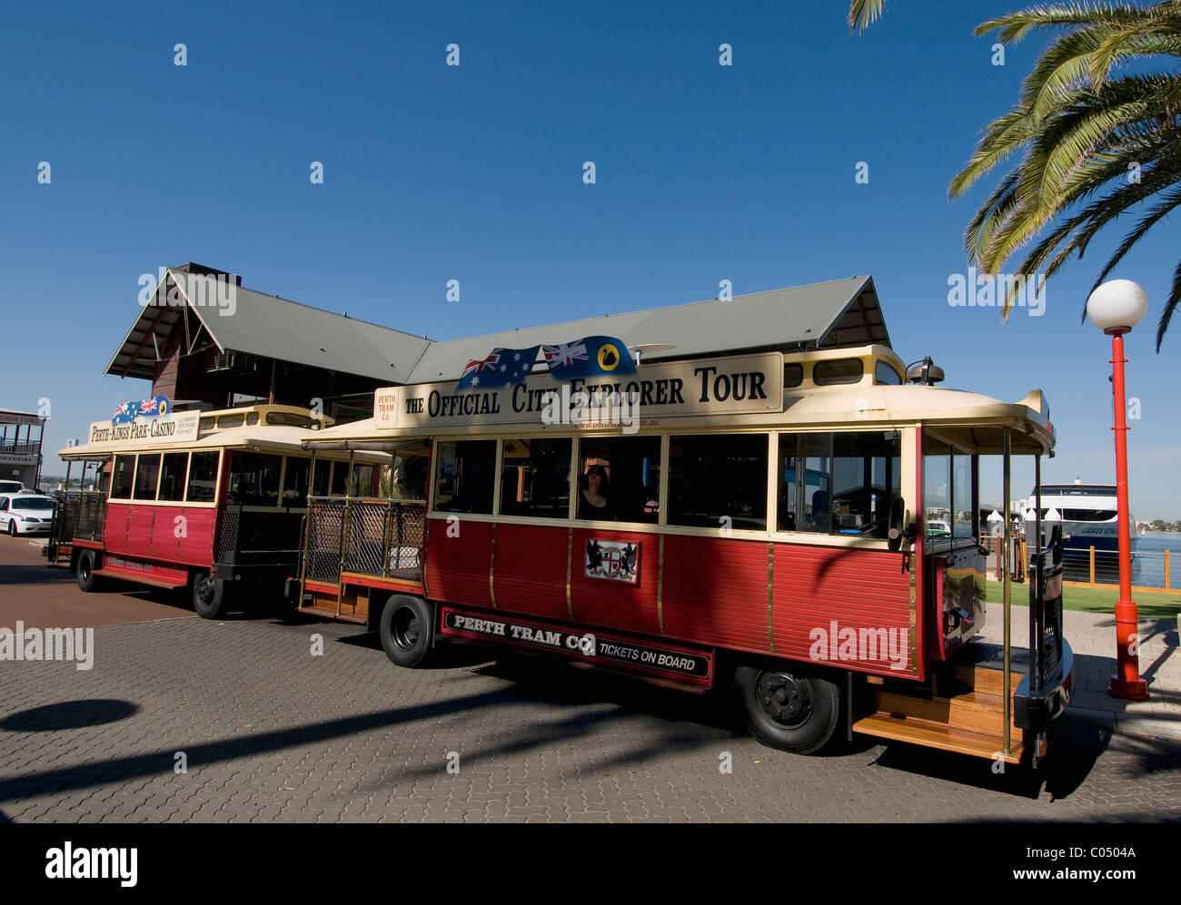 A motorized tram at Barrack Street Jetty in Perth, Western Australia ...