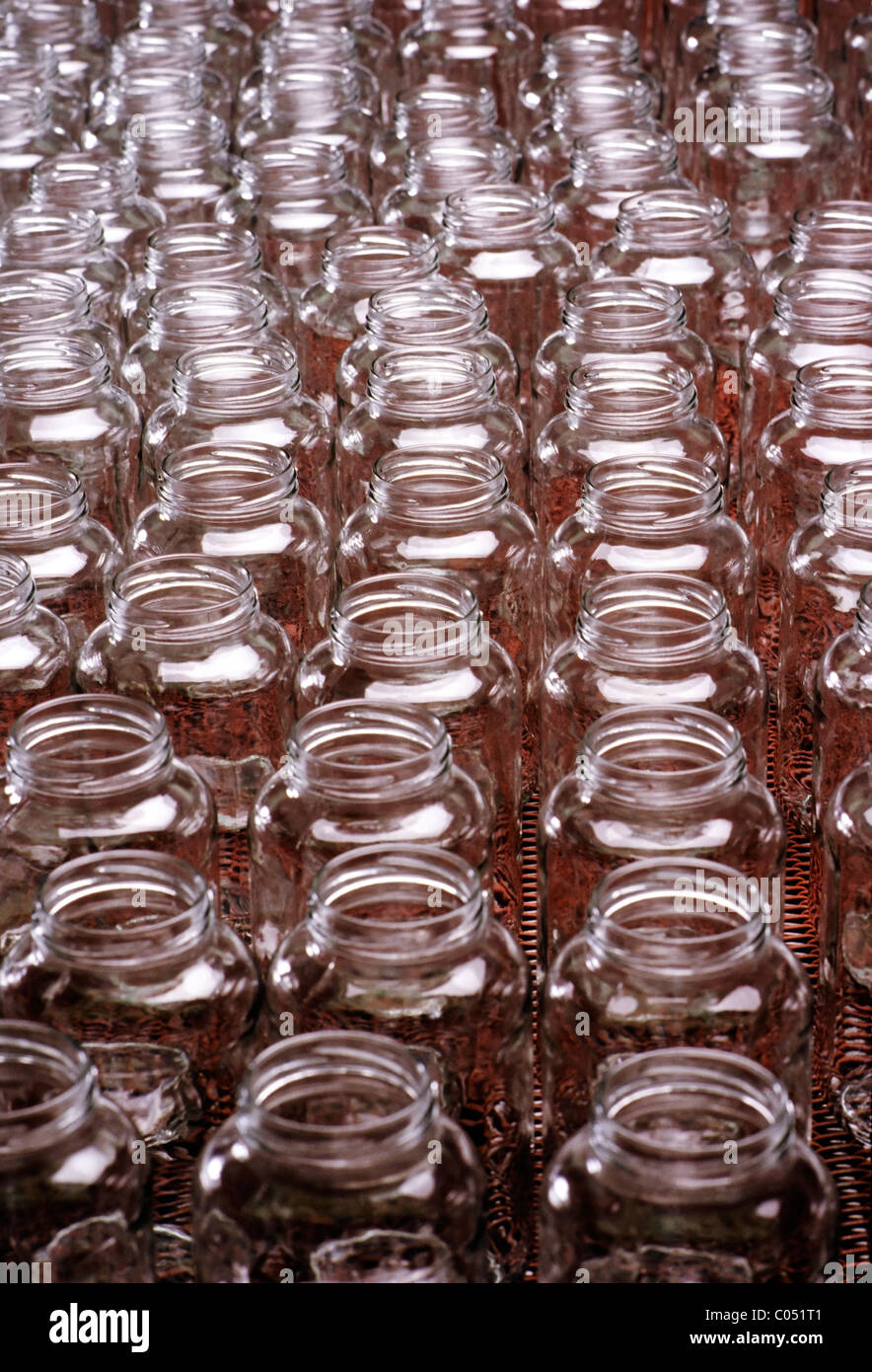 Glass bottles on the assembly line of a glass product manufacturing ...
