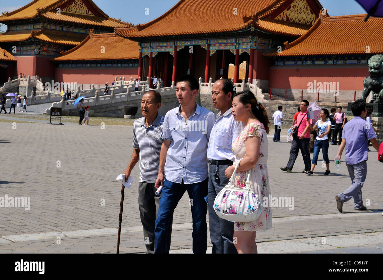 Three generation Chinese family posing for a photograph in the ...